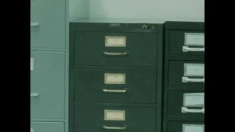 1960s: A row of various filing cabinets. | Stock Video | Pond5