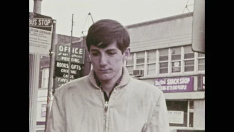 1960s: Sign in window. Boy on sidewalk, ... | Stock Video | Pond5