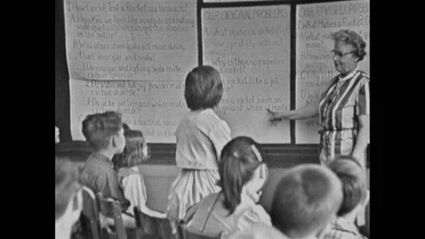 1960s: Teacher stands at front of class,... | Stock Video | Pond5