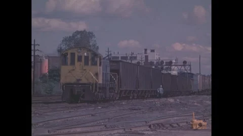 1960s: Train moving in rail yard, man wa... | Stock Video | Pond5