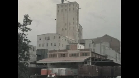 1960s: Trucks parked outside processing ... | Stock Video | Pond5