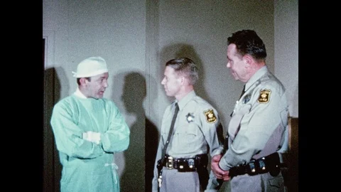 1960s: UNITED STATES: police officers ta... | Stock Video | Pond5