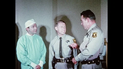 1960s: UNITED STATES: police officers ta... | Stock Video | Pond5