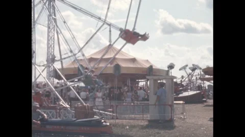 1960s: View of fairgrounds, carnival rid... | Stock Video | Pond5