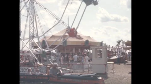 1960s: View of fairgrounds, carnival rid... | Stock Video | Pond5
