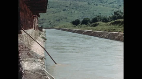 1960s: Water flows in channel into tunne... | Stock Video | Pond5