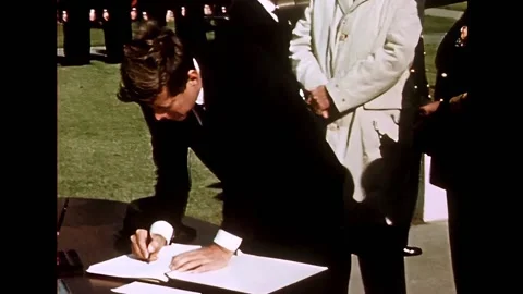 1962 Cold War - Kennedy (JFK) signs docu... | Stock Video | Pond5