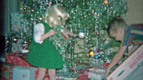 1963: Kid unwrapping road rage electric ... | Stock Video | Pond5