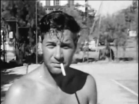 1965- Actor Richard Arlen dives into his... | Stock Video | Pond5
