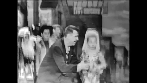 1965 Verna Raymond sings to and tries to... | Stock Video | Pond5