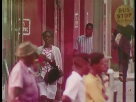 1970- A man enters several stores on the... | Stock Video | Pond5