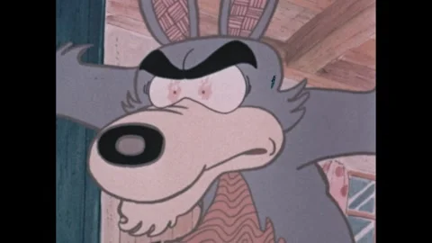 1970s: Animated wolf walks in. Woman lay... | Stock Video | Pond5