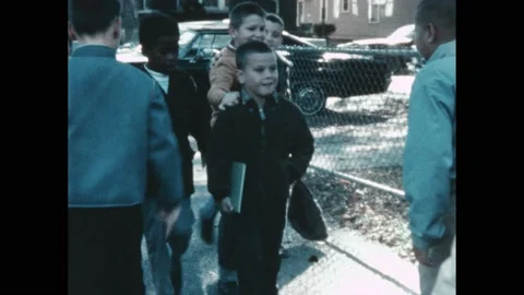1970s: Boy greets classmates in front of... | Stock Video | Pond5
