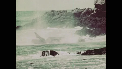 1970s: Car driving off cliff into sea. C... | Stock Video | Pond5