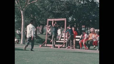 1970s: Children run and grab frame with ... | Stock Video | Pond5