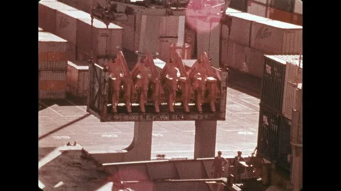 1970s: Crane lifts shipping container fr... | Stock Video | Pond5