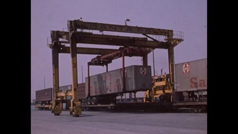 1970s: Crane lowering shipping container... | Stock Video | Pond5