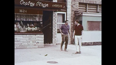 1970s: Dissolve to men arguing outside b... | Stock Video | Pond5