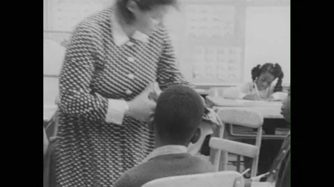1970s: Female teacher writes on board an... | Stock Video | Pond5