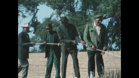 1970s: Four black men with a rope try to... | Stock Video | Pond5