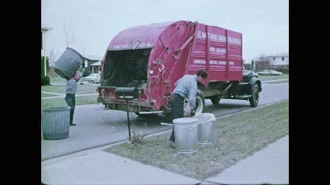 1970s: Garbage men load garbage into tru... | Stock Video | Pond5