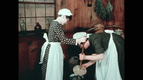 1970s: Girl churning the butter, woman o... | Stock Video | Pond5