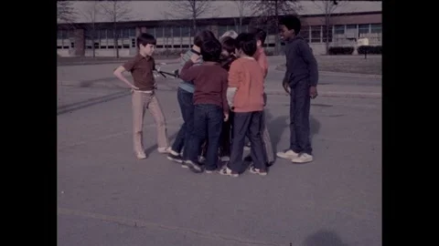1970s: Group of kids playing on playgrou... | Stock Video | Pond5