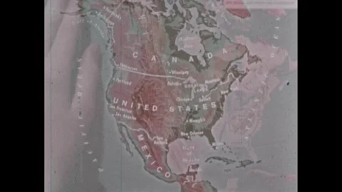 1970s: Hand smooths a map of North Ameri... | Stock Video | Pond5
