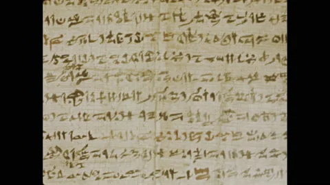 1970s: Hand unrolling papyrus paper. Wri... | Stock Video | Pond5