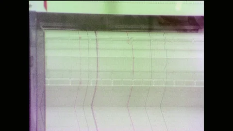 1970s: Lab machine reads graph on paper.... | Stock Video | Pond5