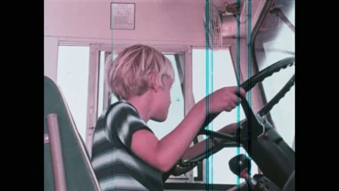 1970s: Little boy drives a school bus. C... | Stock Video | Pond5