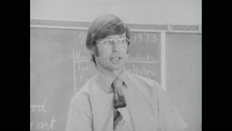 1970s: Male teacher stands at front of c... | Stock Video | Pond5