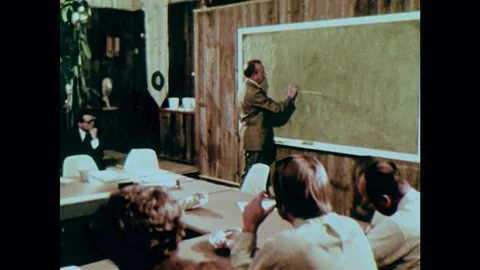 1970s: Man at chalkboard in classroom, z... | Stock Video | Pond5