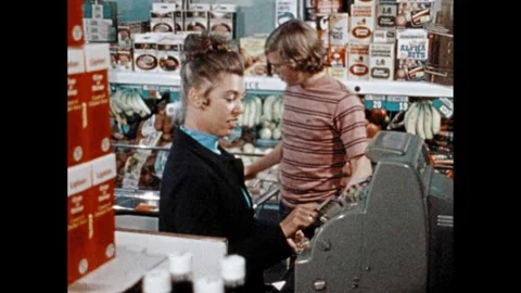 1970s: Man pulls his cart to the cashier... | Stock Video | Pond5