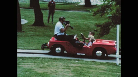 1970s: Man stands behind camera on rooft... | Stock Video | Pond5