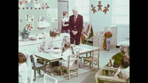 1970s: Man stands in classroom, talks. C... | Stock Video | Pond5