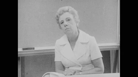 1970s: Master teacher sits and speaks in... | Stock Video | Pond5