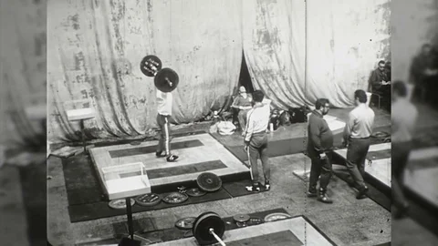 Vintage Weight Lifting Stock Footage ~ Royalty Free Stock Videos | Pond5