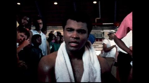 1970s: Muhammad Ali talks. People stand ... | Stock Video | Pond5