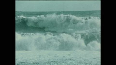 1970s: Ocean waves roll on to shore. Rap... | Stock Video | Pond5