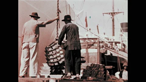 1970s: People load cargo onto ship. Man ... | Stock Video | Pond5