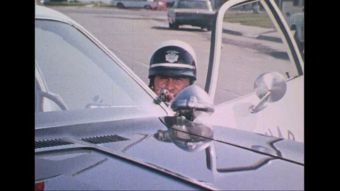 1970s: Police officer points gun behind ... | Stock Video | Pond5
