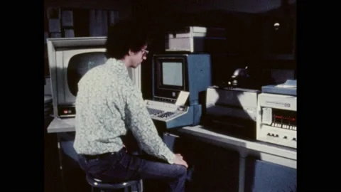 1970s: Shots of man working at computer ... | Stock Video | Pond5