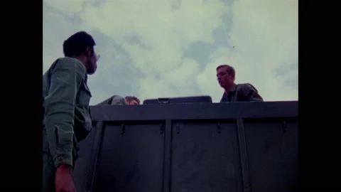 1970s: Soldiers unload cargo from vehicl... | Stock Video | Pond5