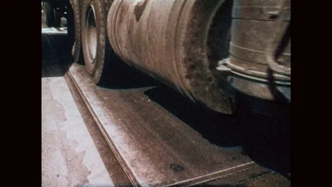 1970s: Truck wheels drive over scale. Sc... | Stock Video | Pond5