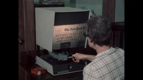 1970s: Woman at a microfiche reader skim... | Stock Video | Pond5