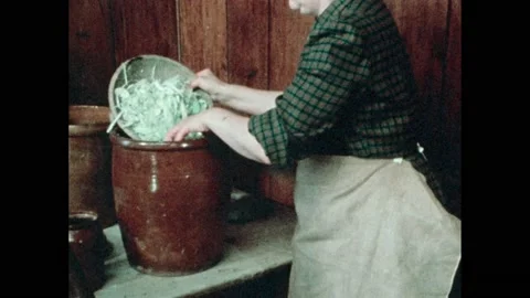 1970s: Woman pounding cabbage in a barre... | Stock Video | Pond5