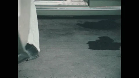 1970s:Feet walk around car, step into ve... | Stock Video | Pond5