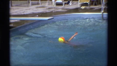 1971: a view of a swimming pool, a child... | Stock Video | Pond5