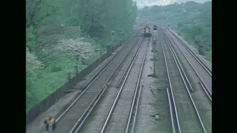 1974 England - A train drives on the rai... | Stock Video | Pond5